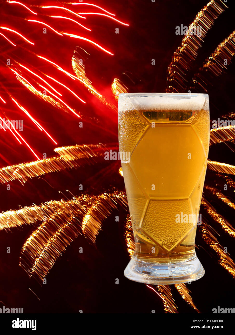Froth beer glass on multicolored fireworks background Stock Photo - Alamy