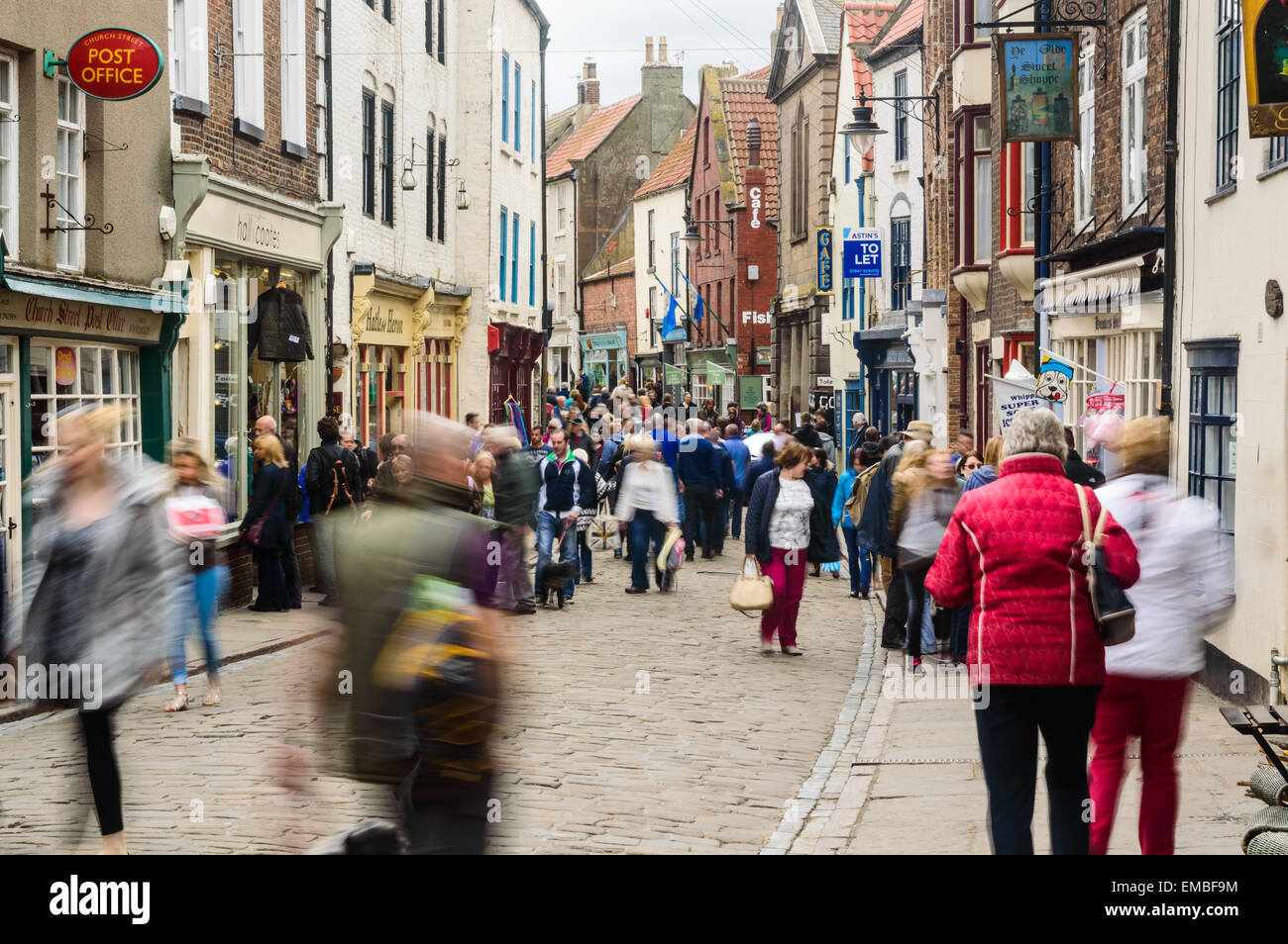 People shopping on Church Street, in Whitby, North Yorkshire, England ...