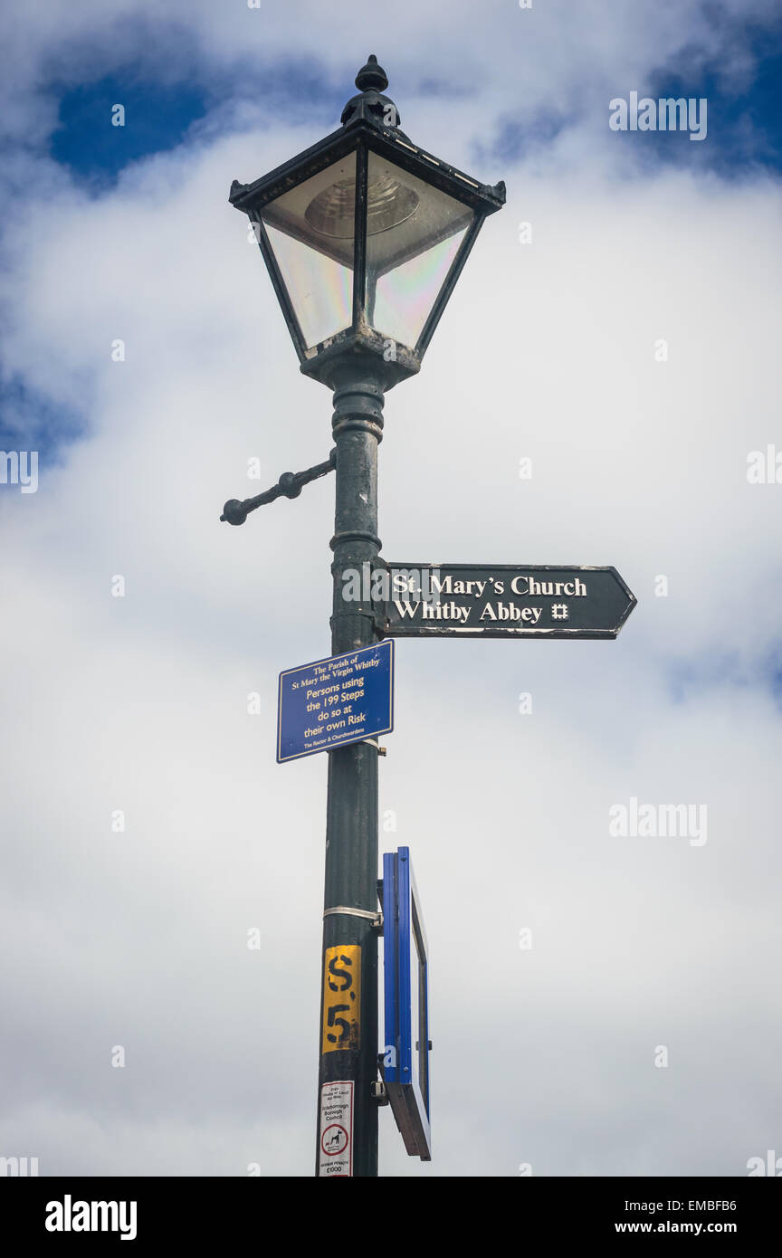 A lamp post with a sign for St Mary's Church and Whitby Abbey, in ...