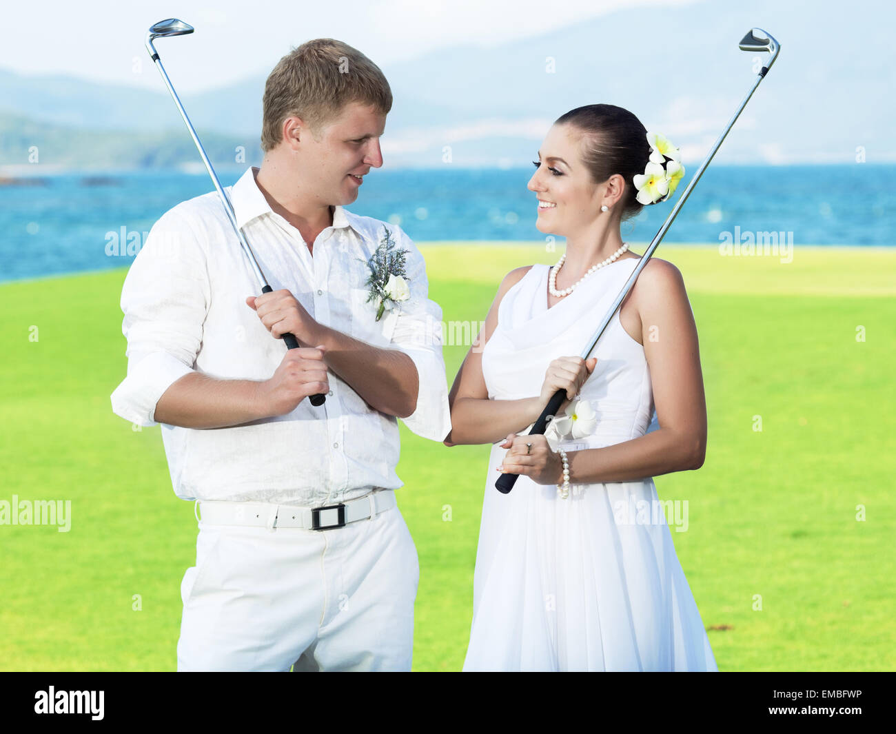 Bride and groom are playing golf at wedding day Stock Photo - Alamy