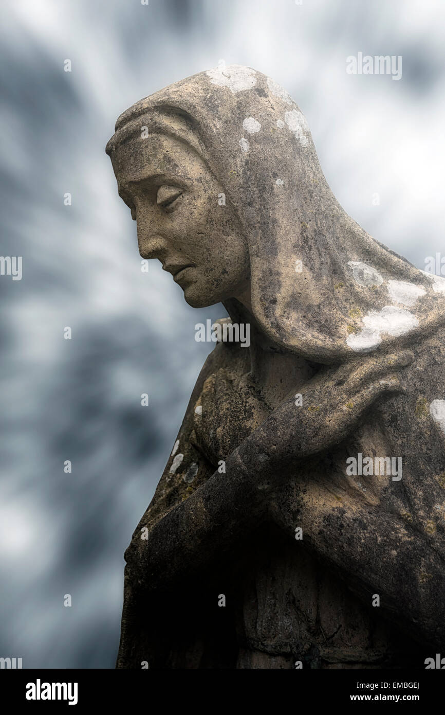 an old statue made out of stone Stock Photo - Alamy