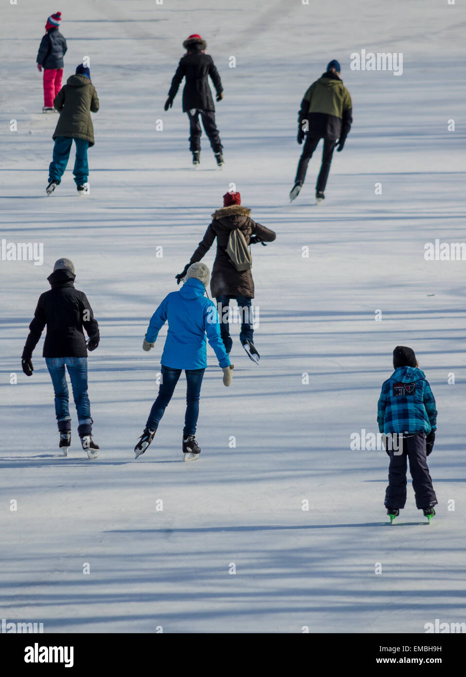 People skating on a natural rink Stock Photo - Alamy