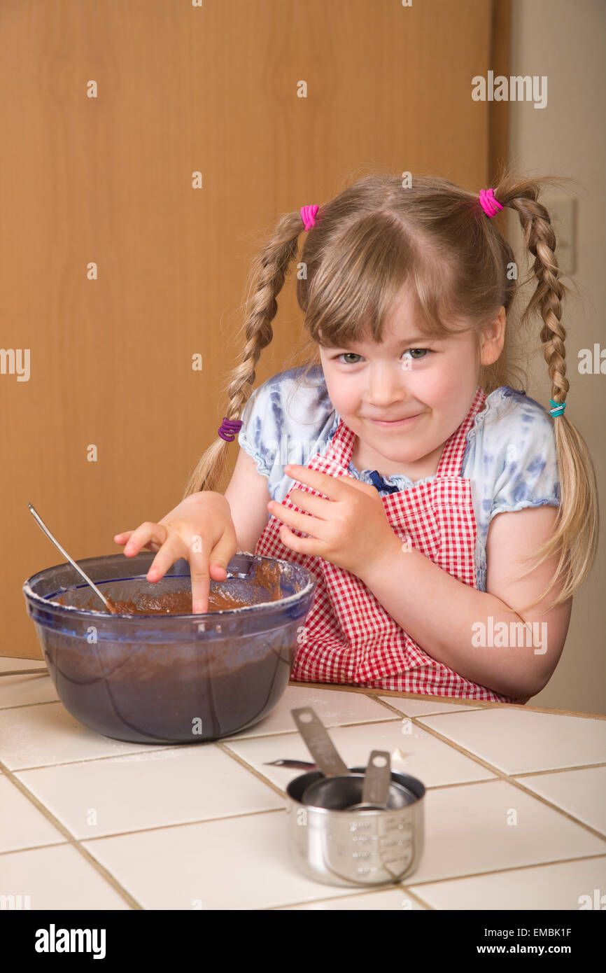 Girl sneaking chocolate cake hi-res stock photography and images - Alamy