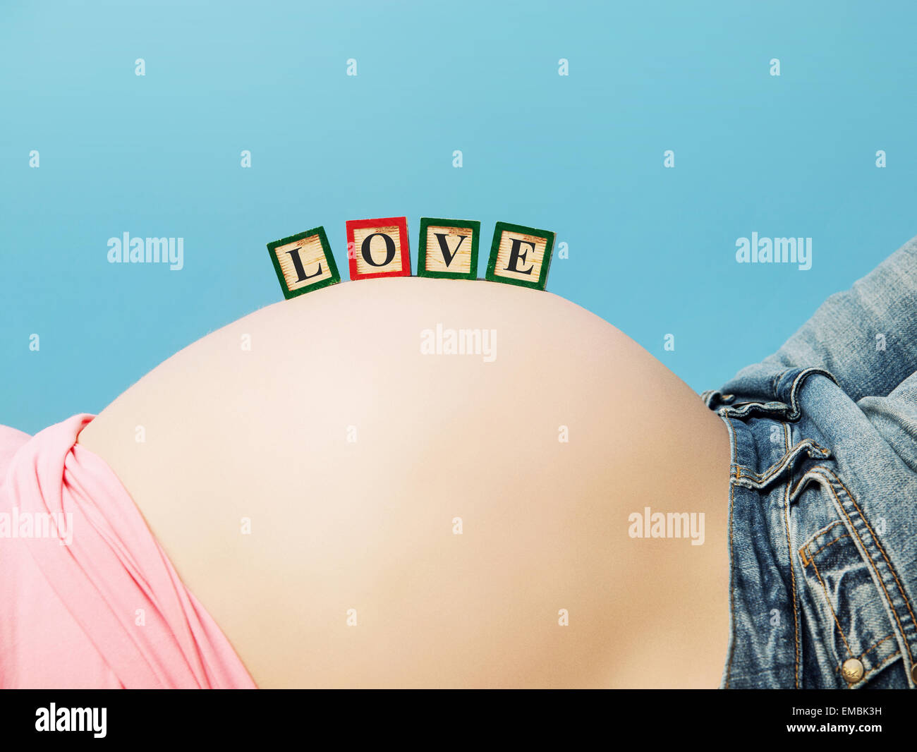 Letter boxes on the pregnant woman belly Stock Photo - Alamy