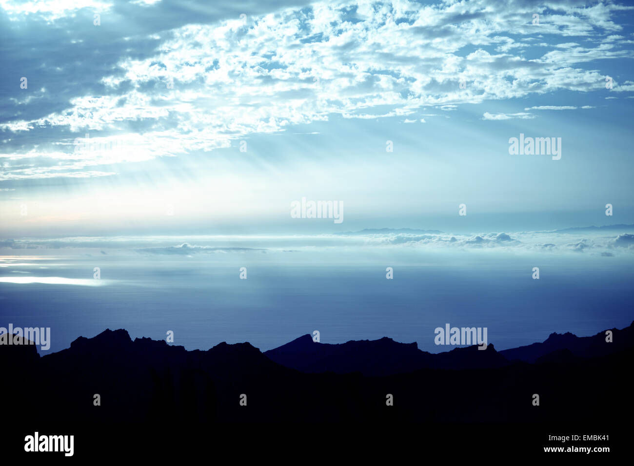 Beautiful view of the sun beams among the clouds Stock Photo - Alamy