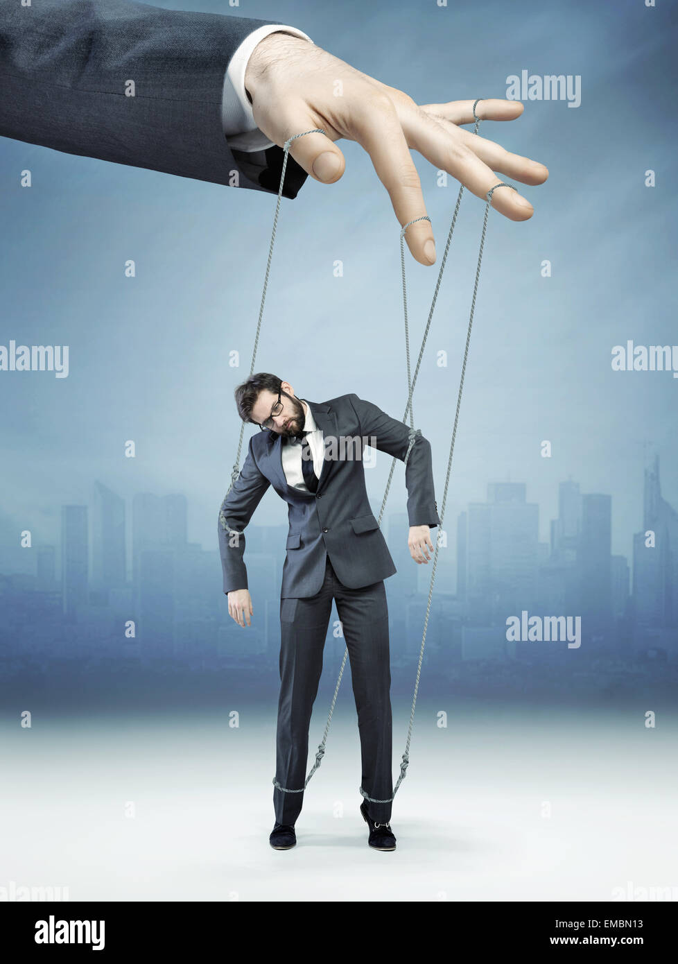 Conceptual photo of controlled employee Stock Photo - Alamy