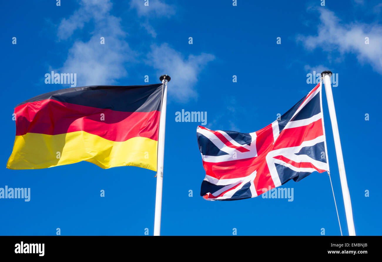 Flags of Germany and United Kingdom against blues sky Stock Photo - Alamy