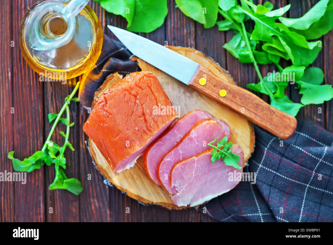 smoked meat on board and on a table Stock Photo - Alamy