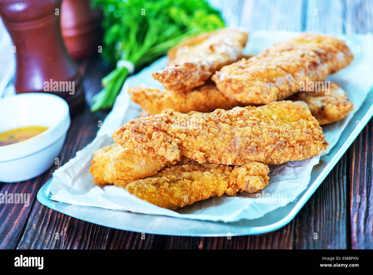 fried fish on tray and on a table Stock Photo - Alamy