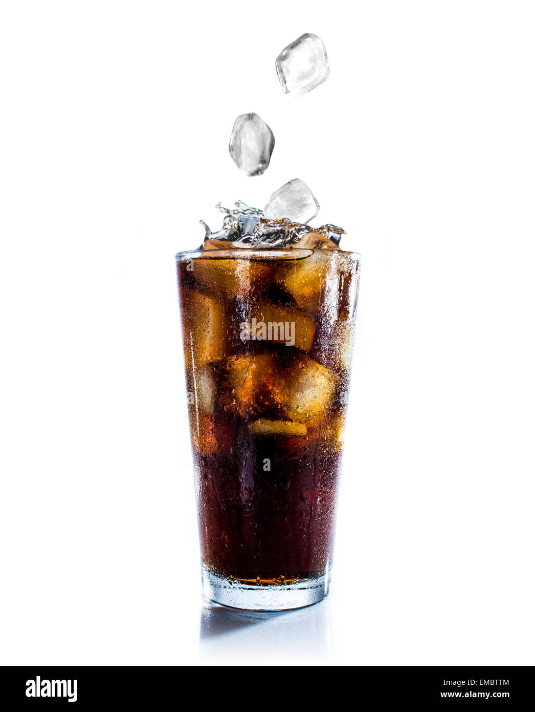 Cola drink splash with ice cube on white background Stock Photo - Alamy