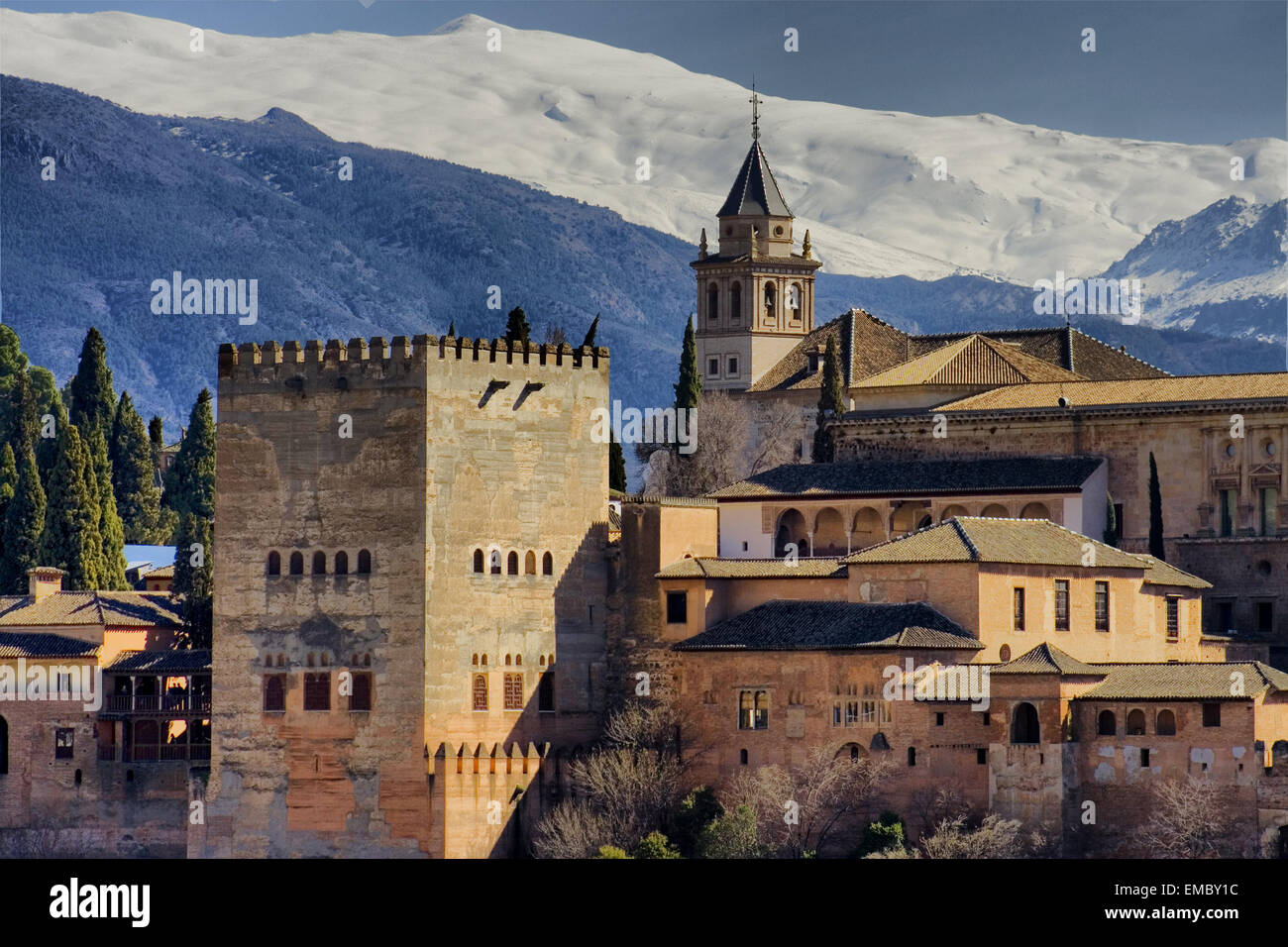 The Alhambra of Granada in Spain with Sierra Nevada snowy mountains as ...