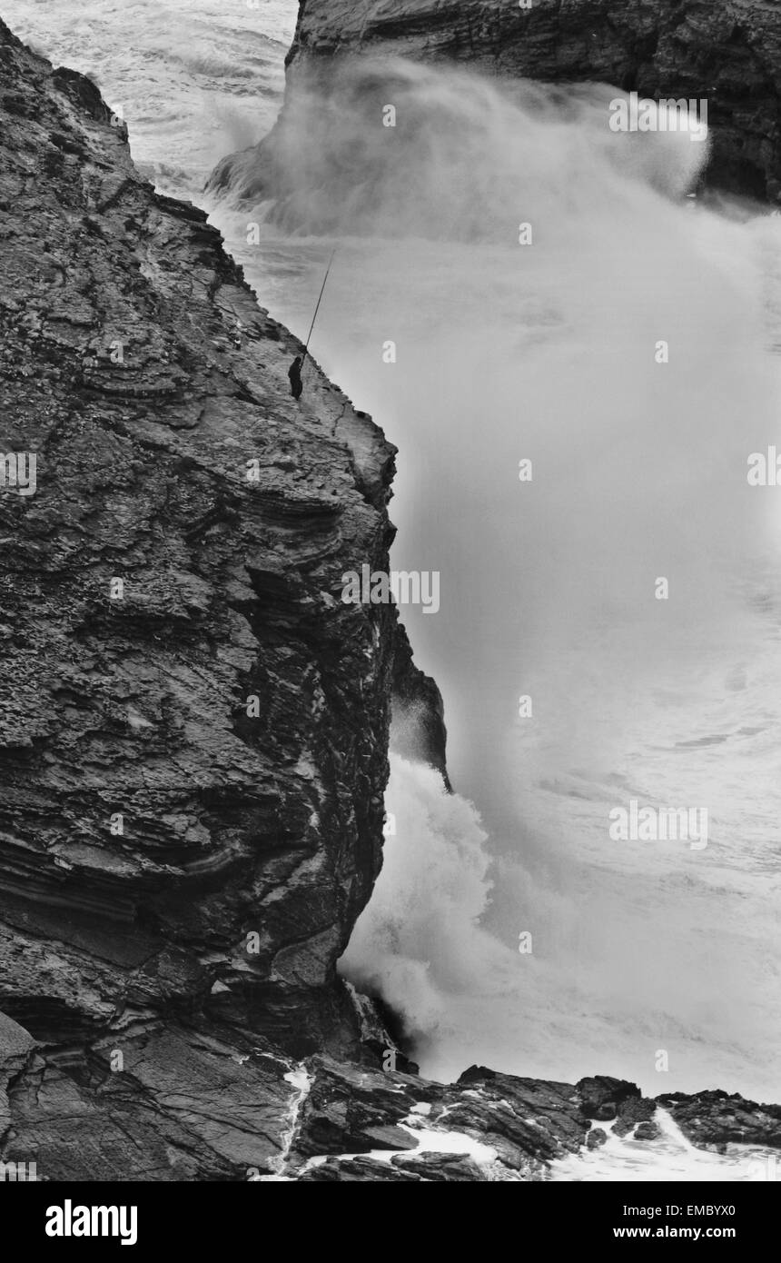 Severe dramatic seascape with fisherman in Cape Saint Vicent cliffs on ...