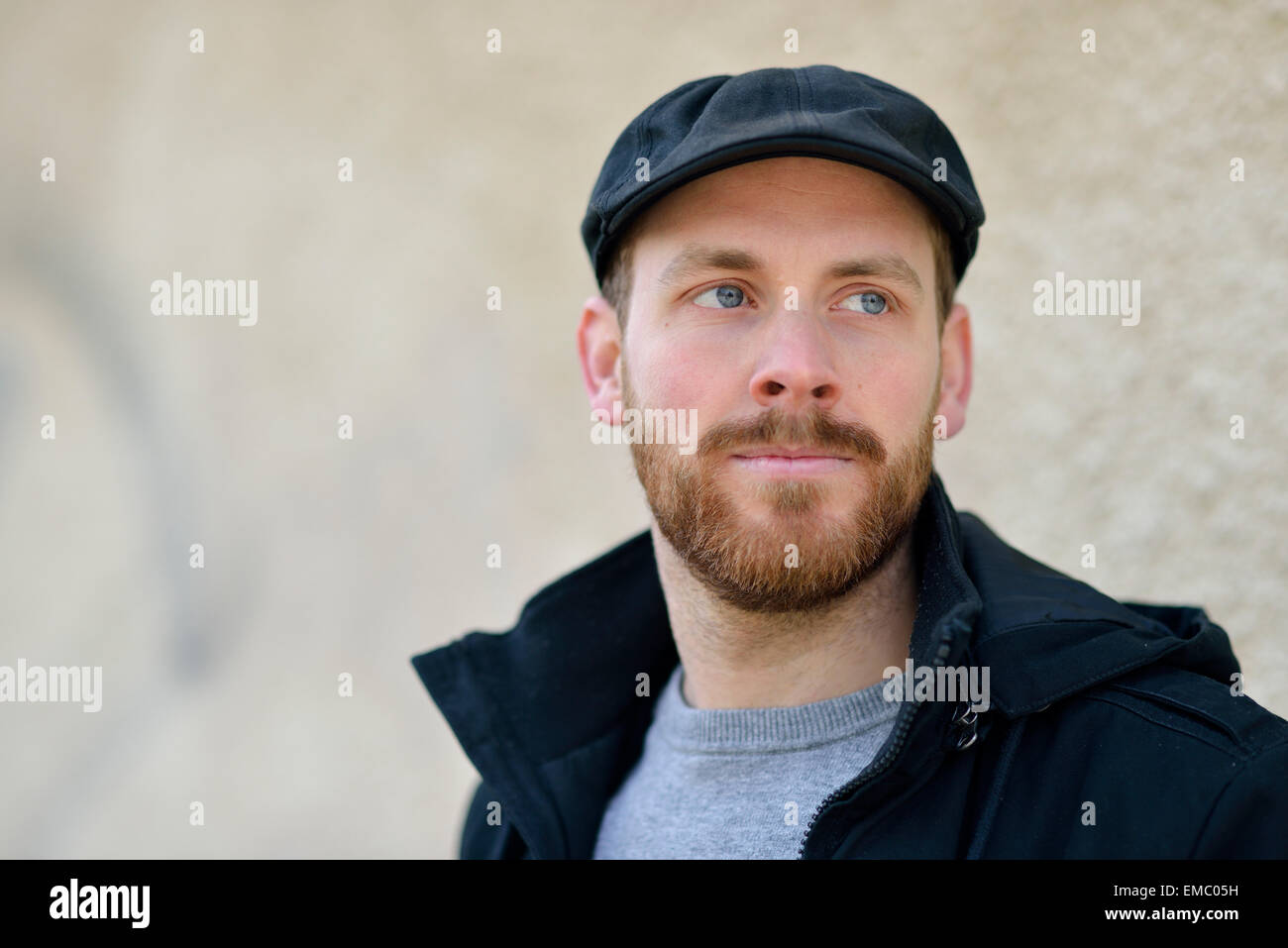 Portrait of young man wearing black cap Stock Photo - Alamy