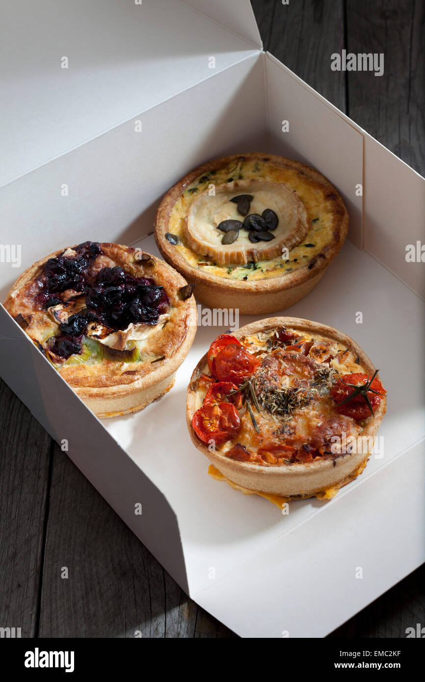 Three different tarts in a cardboard box Stock Photo - Alamy