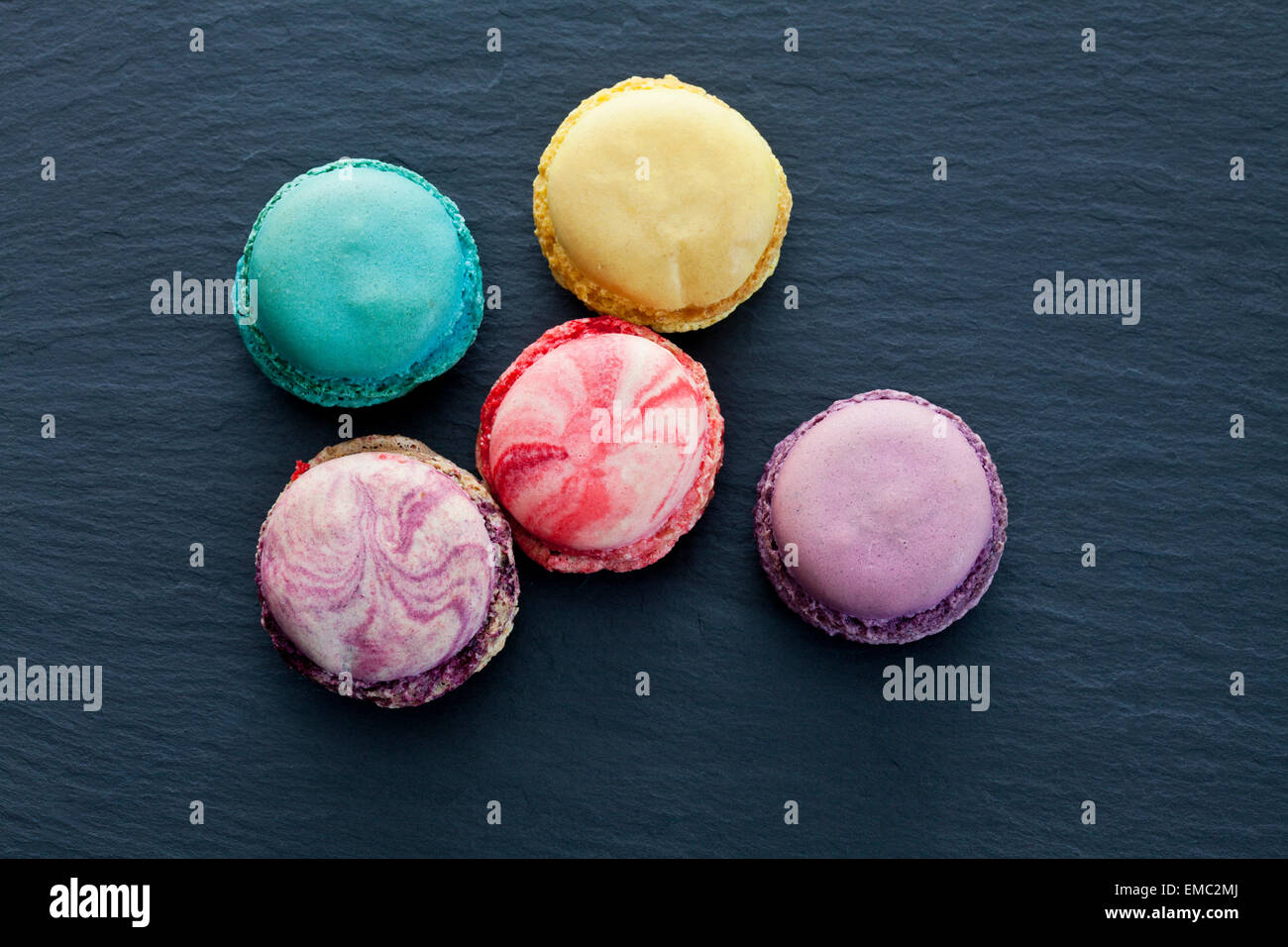 Five different macarons on slate Stock Photo - Alamy