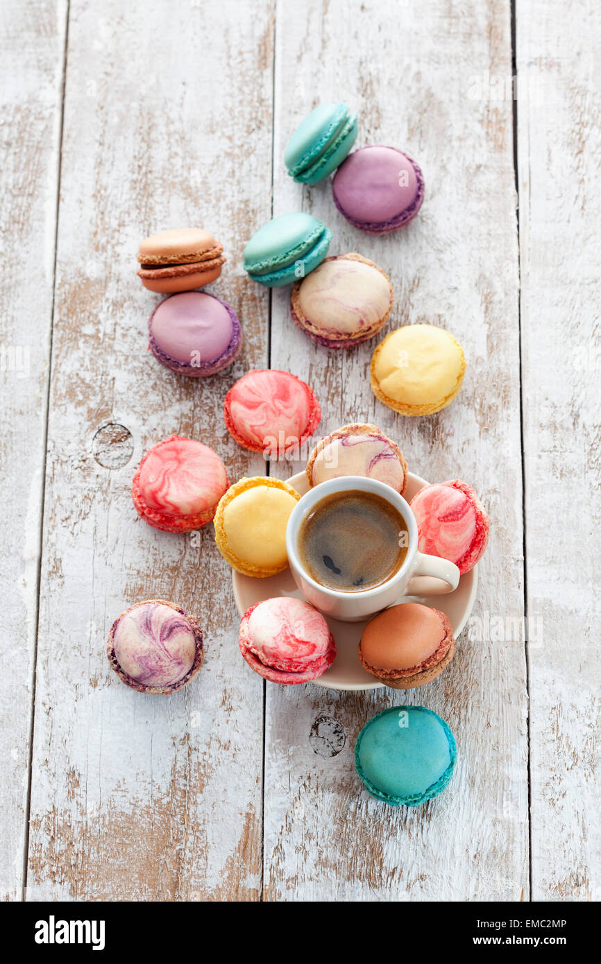 Cup of coffee and macarons on wood Stock Photo - Alamy