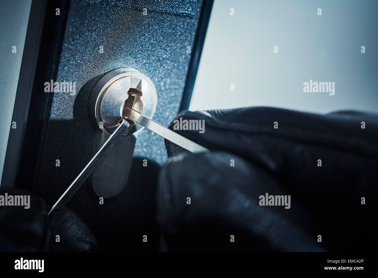 Burglar using a picklock at the door Stock Photo - Alamy
