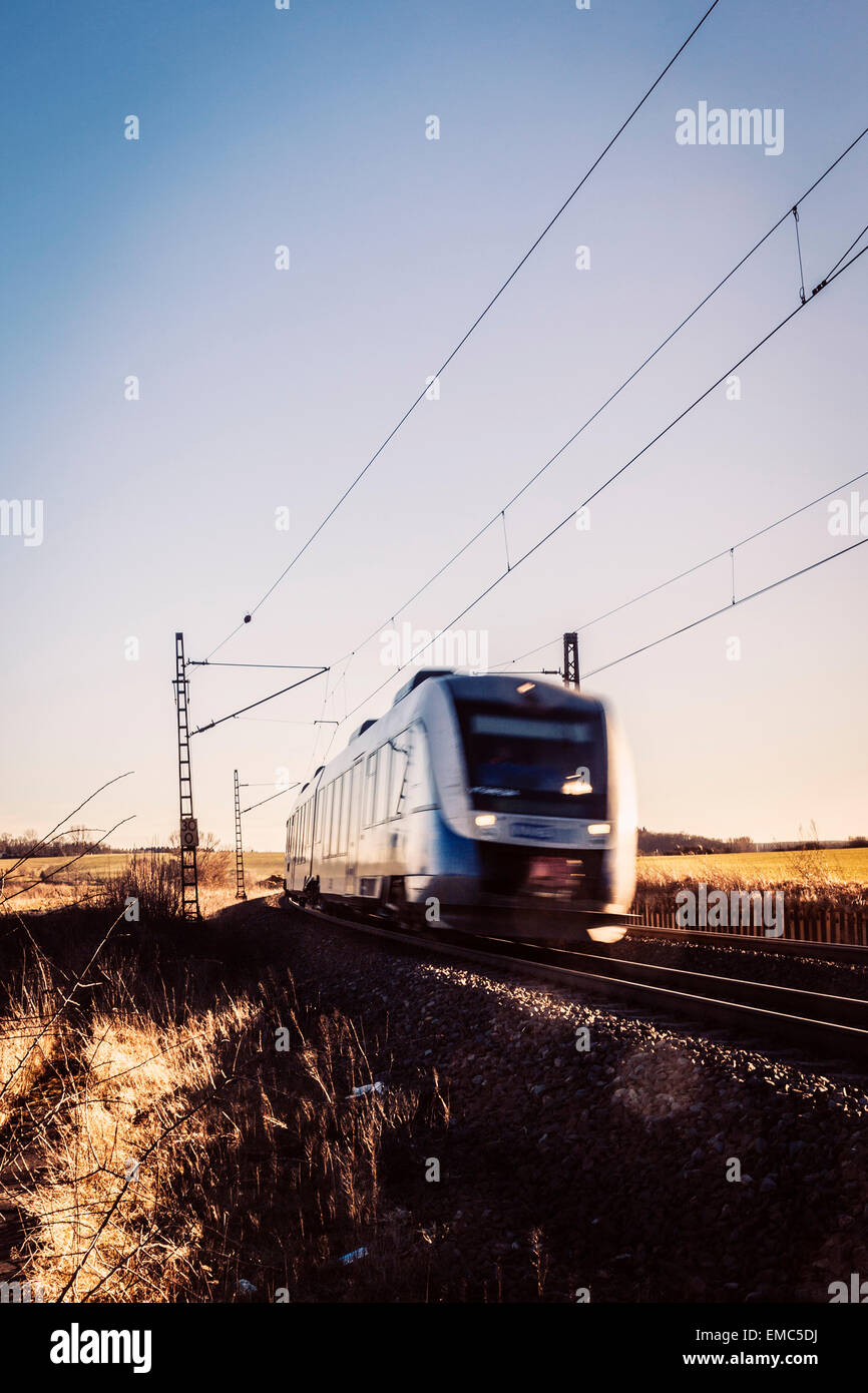 Germany, Burgstemmen, driving regional train at rural scene Stock Photo ...