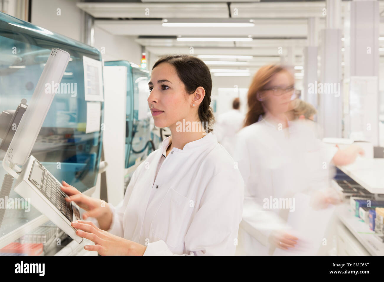 Scientists working in laboratory Stock Photo - Alamy