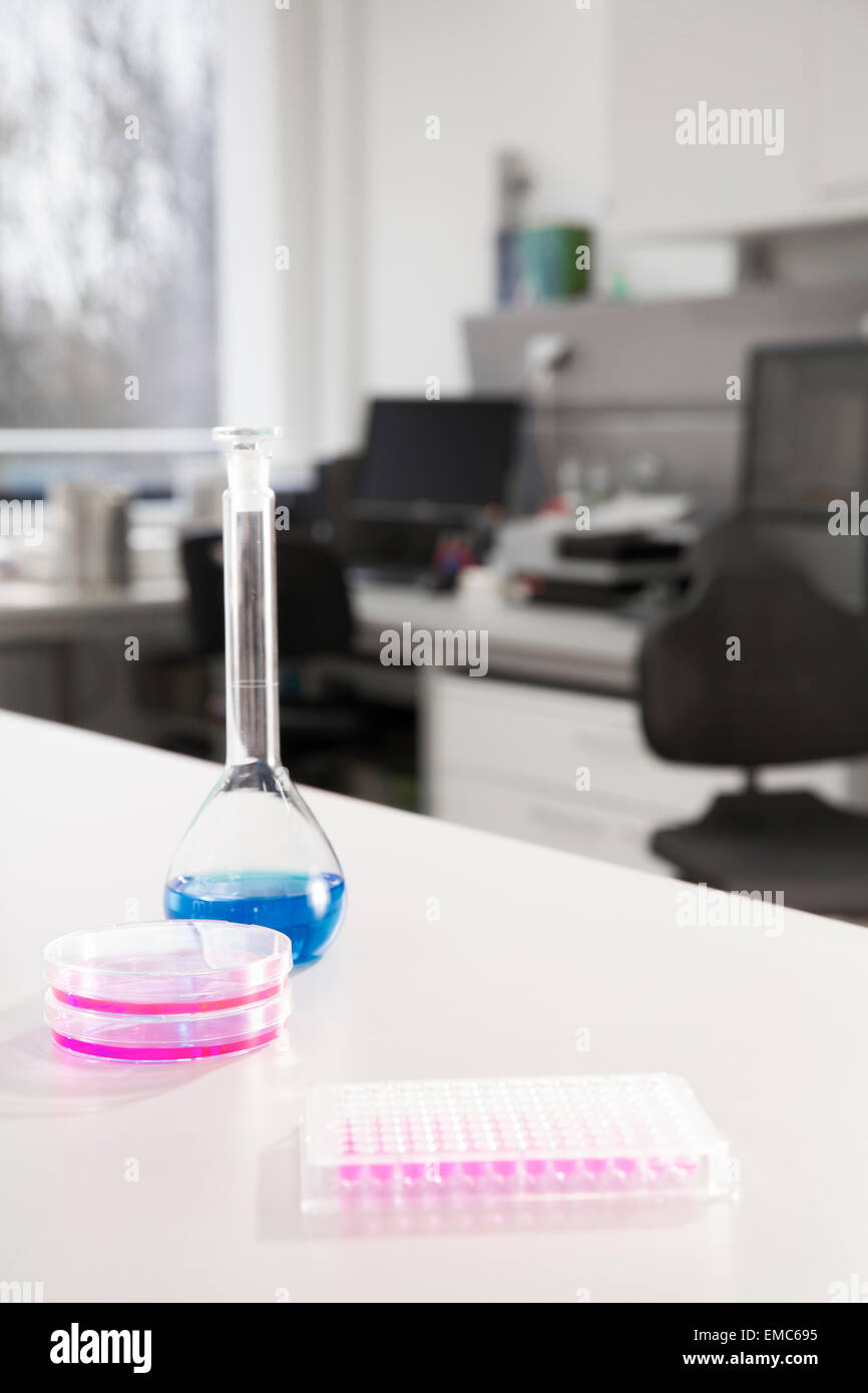 Laboratory glasses on desk Stock Photo - Alamy