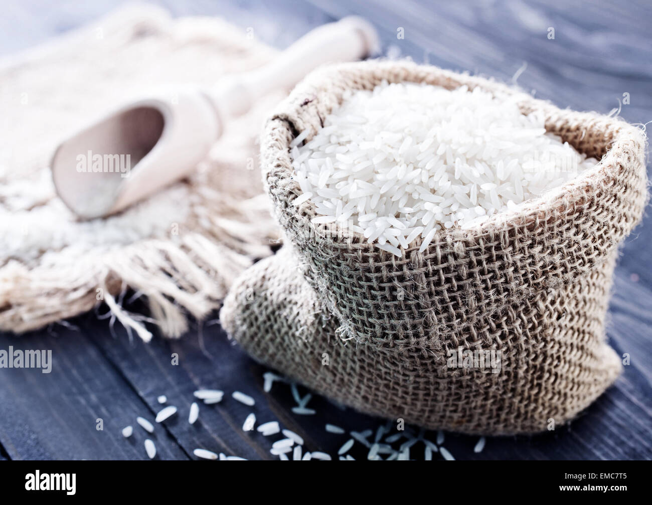 raw rice in bag and on a table Stock Photo - Alamy