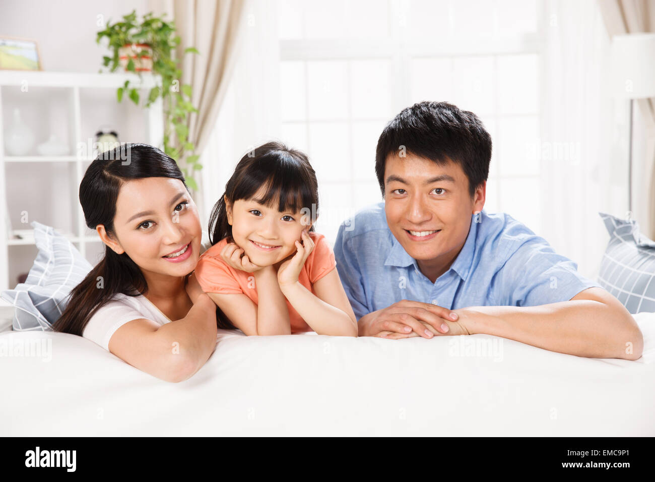 Three people in living room hi-res stock photography and images - Alamy