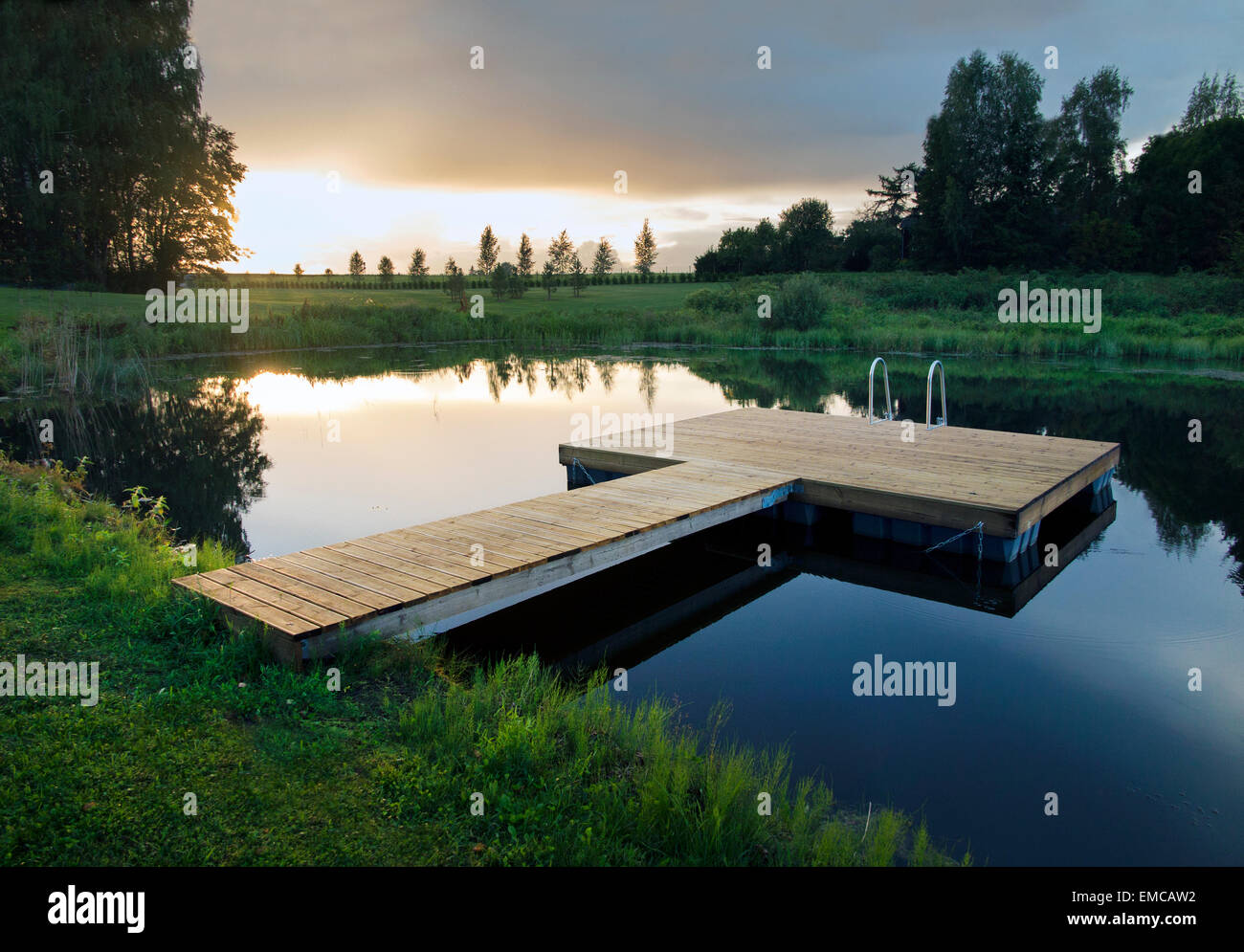 Wooden floating platform by lake at sunset hi-res stock photography and ...