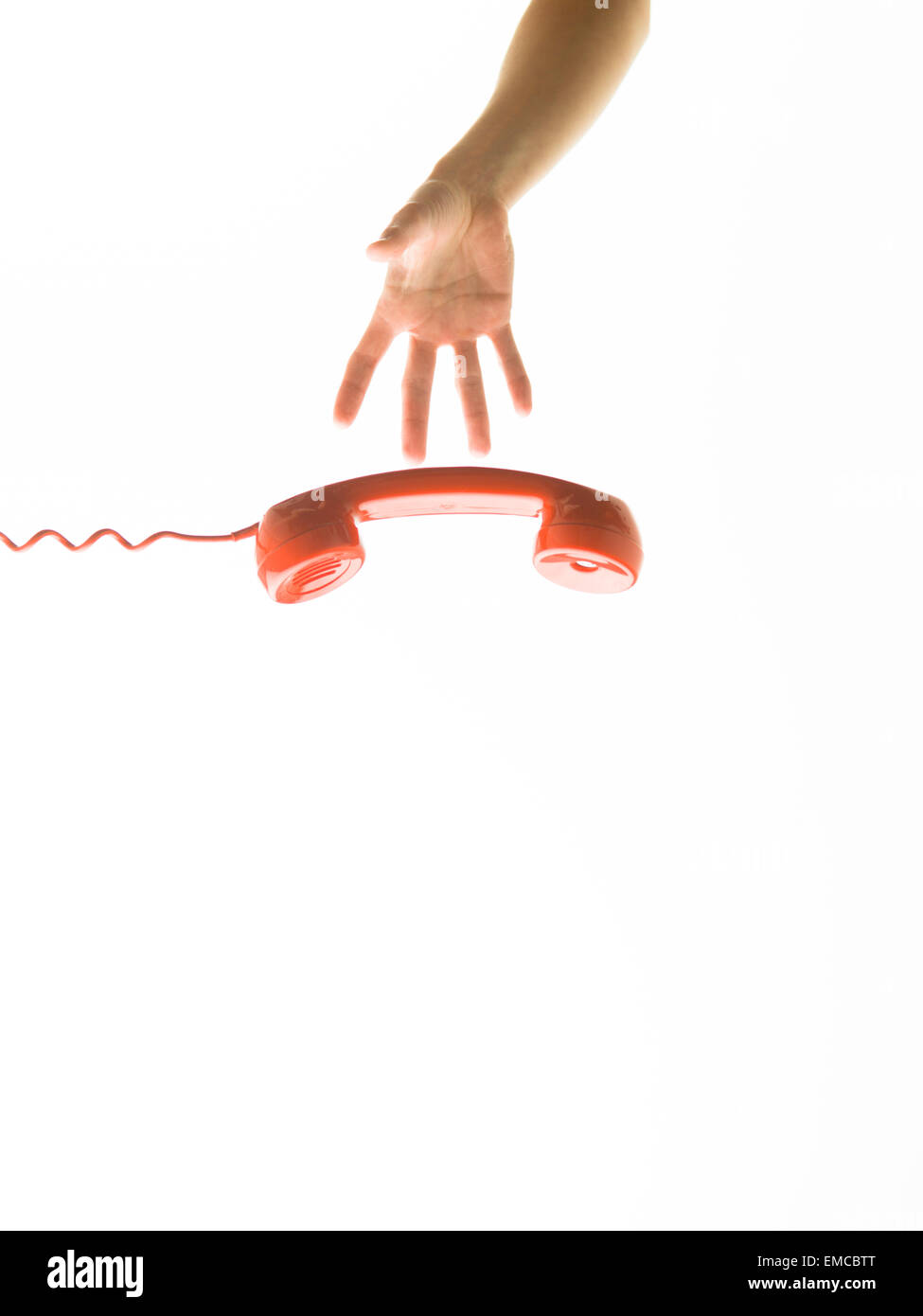 human hand reaching for red phone receiver, isolated on white ...