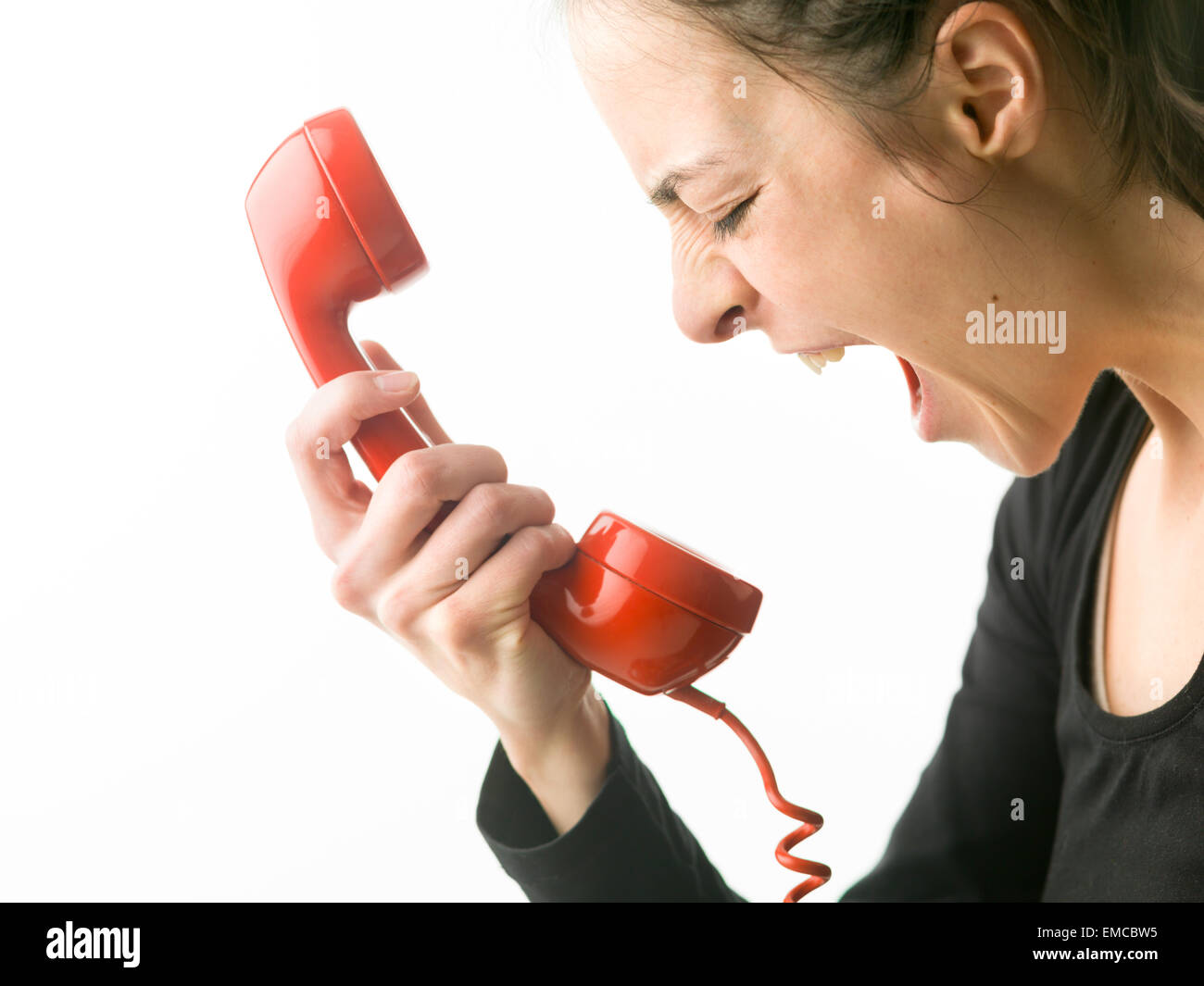 side view of caucasian woman screaming at a phone receiver Stock Photo ...