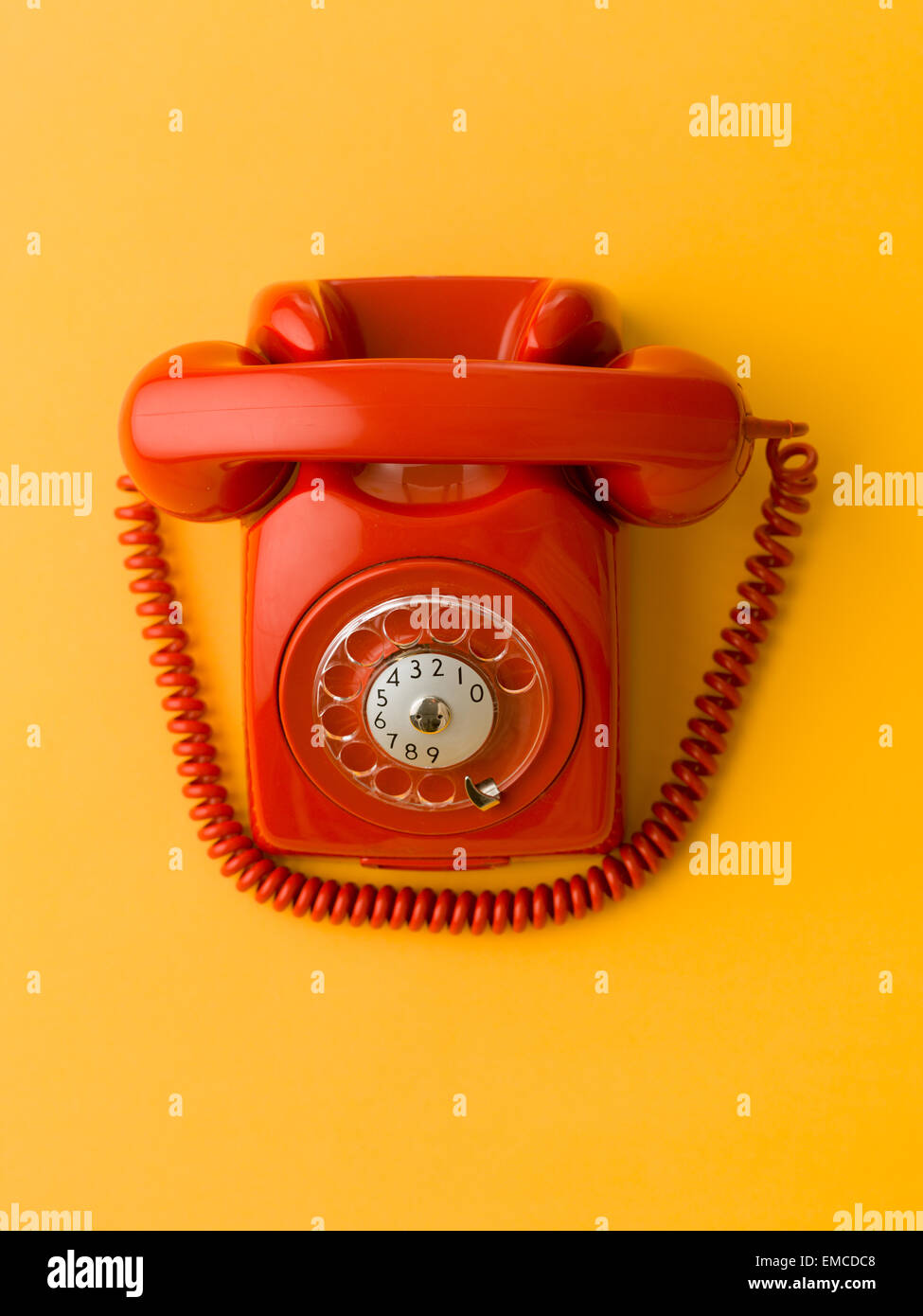 upper view of red vintage phone on blue background Stock Photo - Alamy