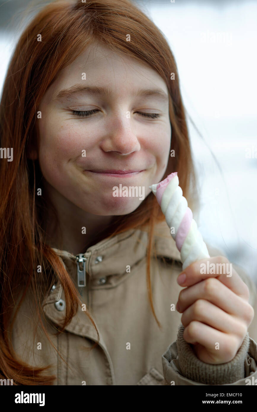 Girl enjoying marshmallow Stock Photo - Alamy Girl enjoying marshmallow Stock Photo - Alamy