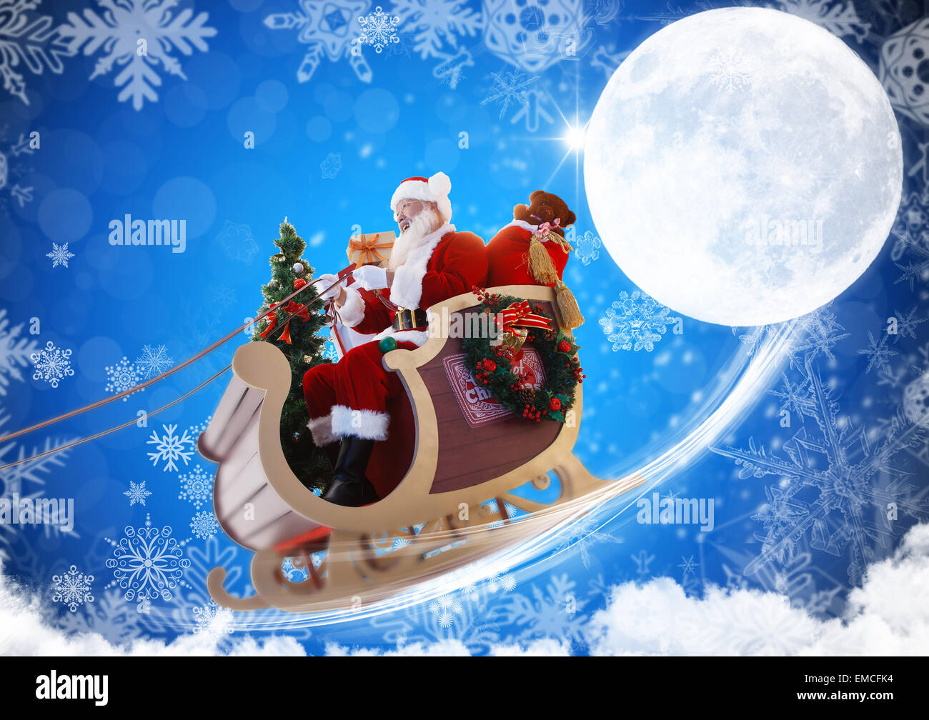 Santa Claus rides the sled to send a gift Stock Photo - Alamy