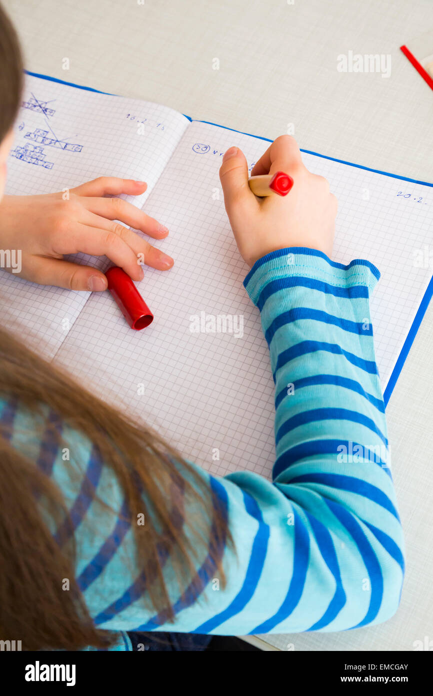 Girl doing mathematics homework Stock Photo - Alamy