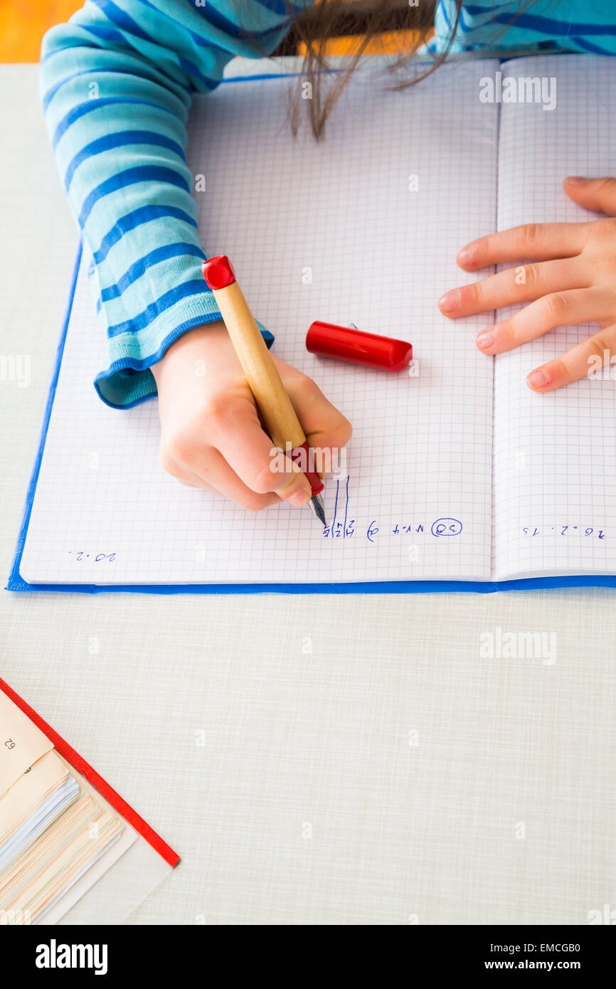 Girl doing mathematics homework Stock Photo - Alamy