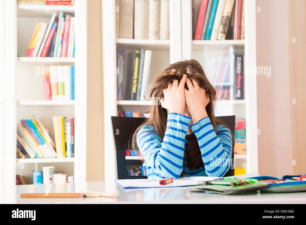 Frustrated girl doing homework Stock Photo - Alamy