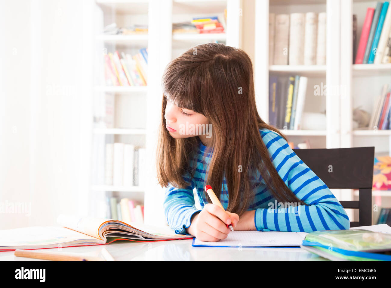 Girl doing homework Stock Photo - Alamy