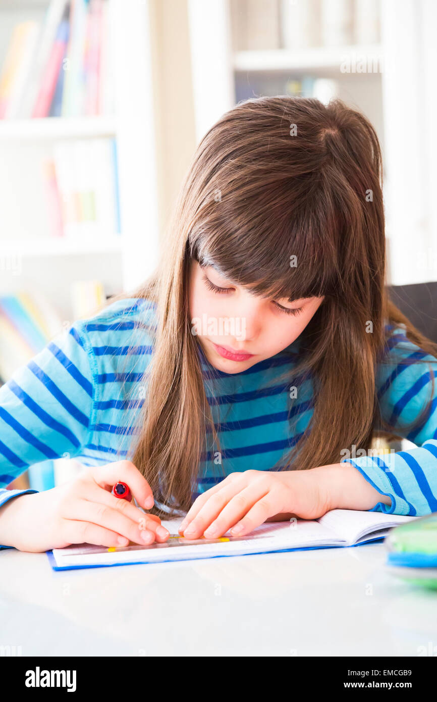 Girl doing homework Stock Photo - Alamy
