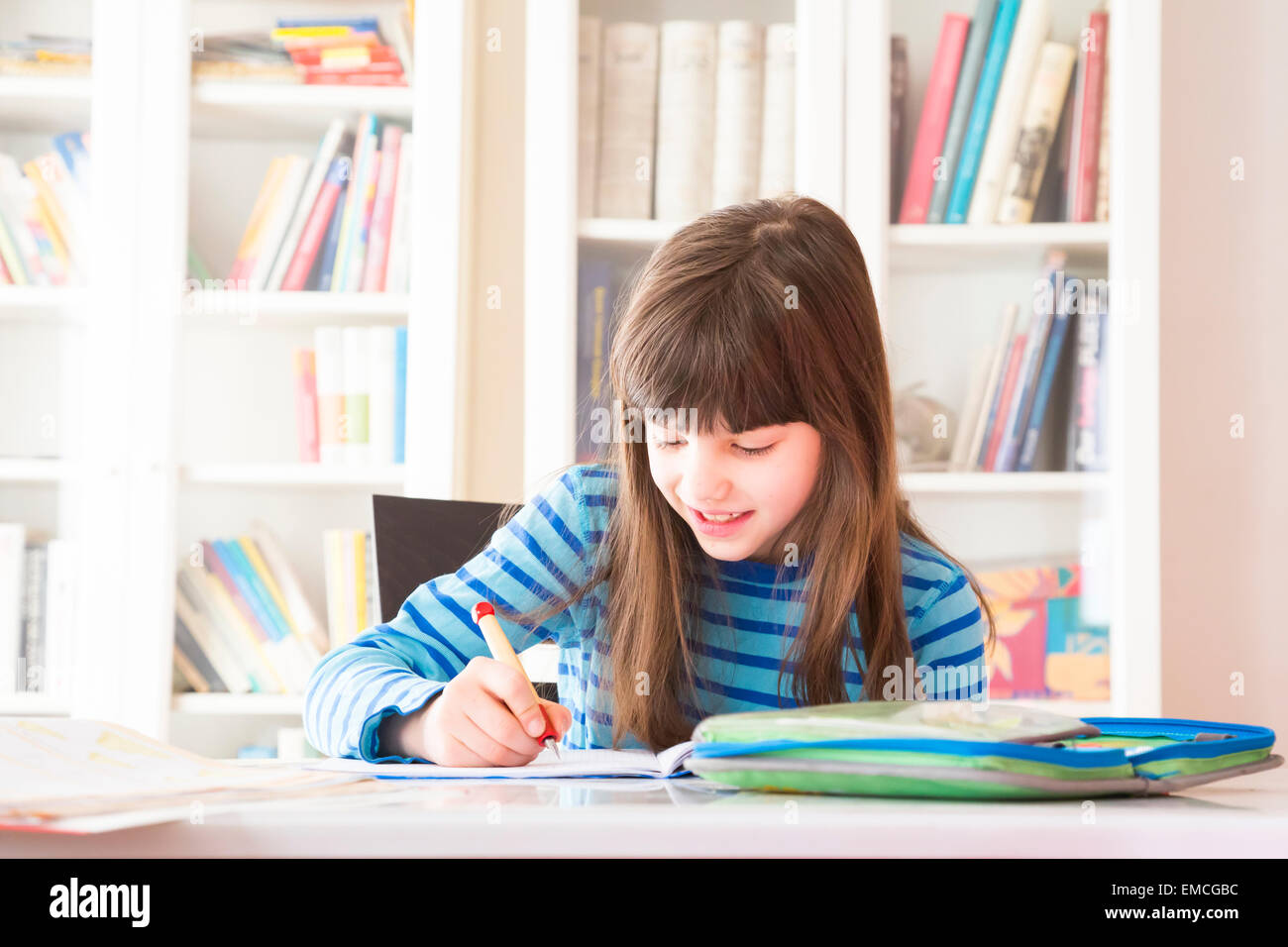 Girl doing homework Stock Photo - Alamy