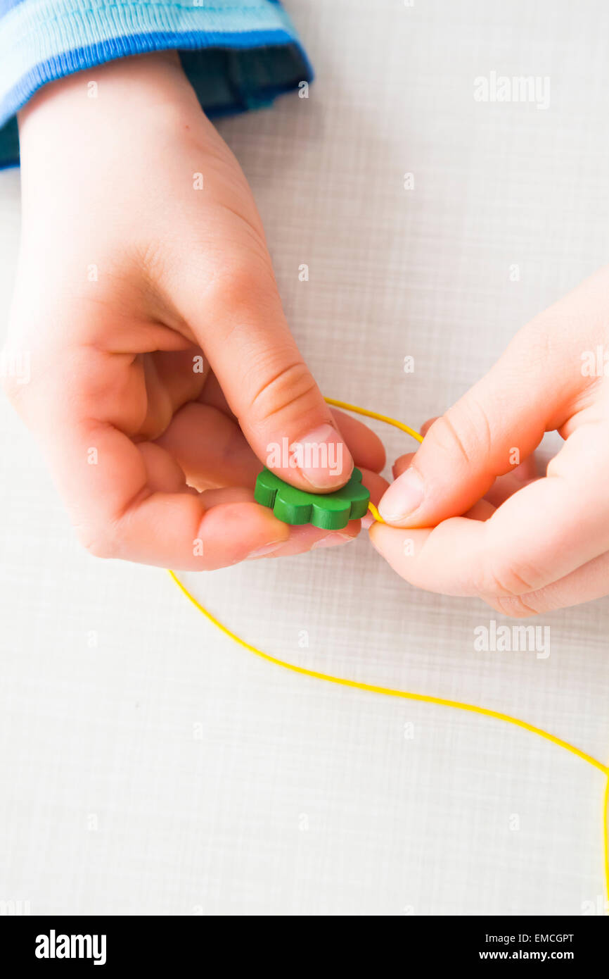 Pearl stringing hi-res stock photography and images - Alamy