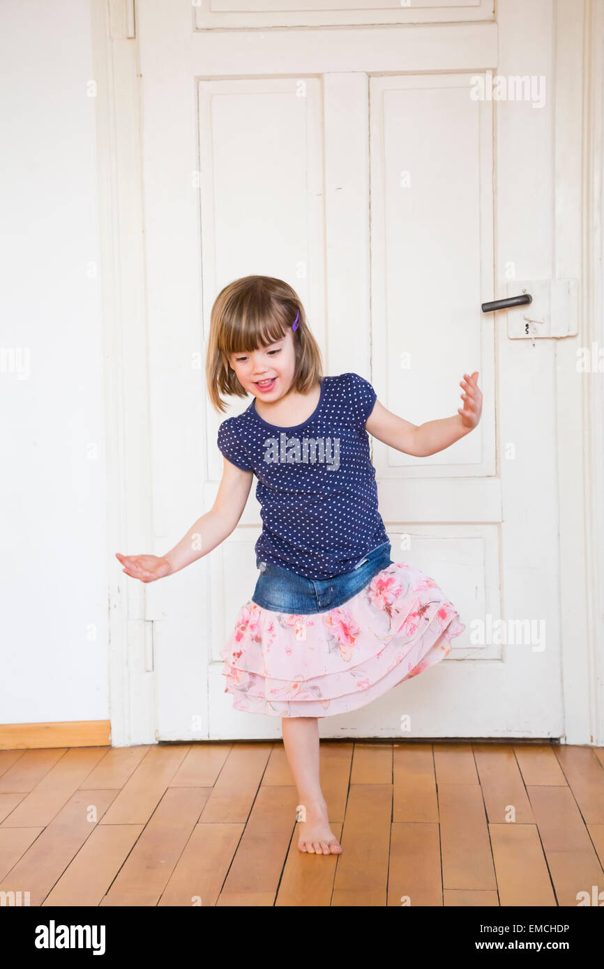 Girl dancing at wooden door Stock Photo - Alamy