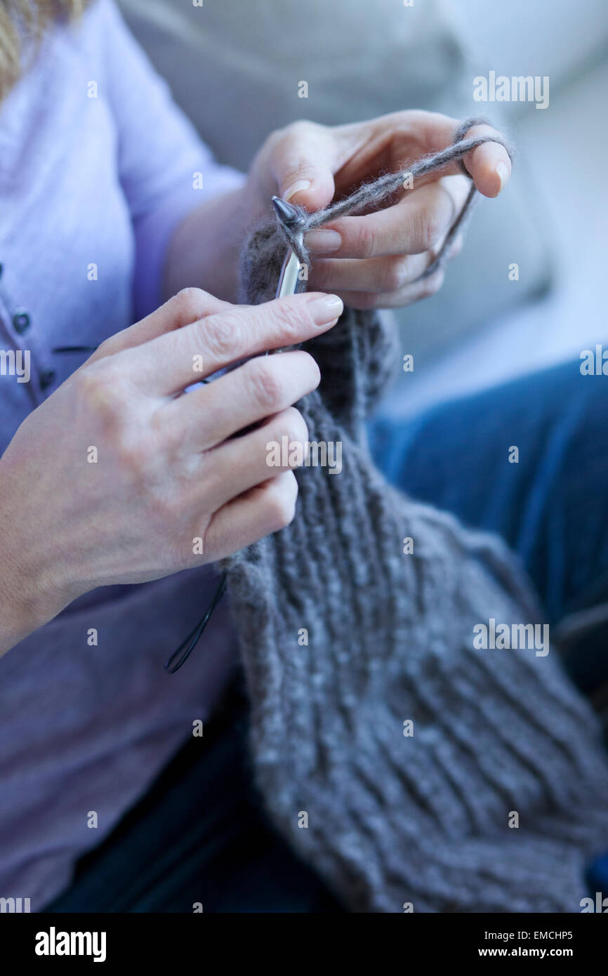 Hands of woman knitting Stock Photo - Alamy