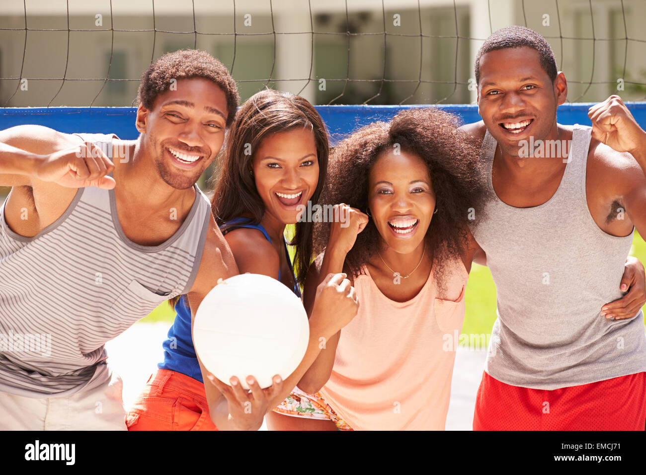 Portrait Of Friends Playing Volleyball Match Stock Photo - Alamy