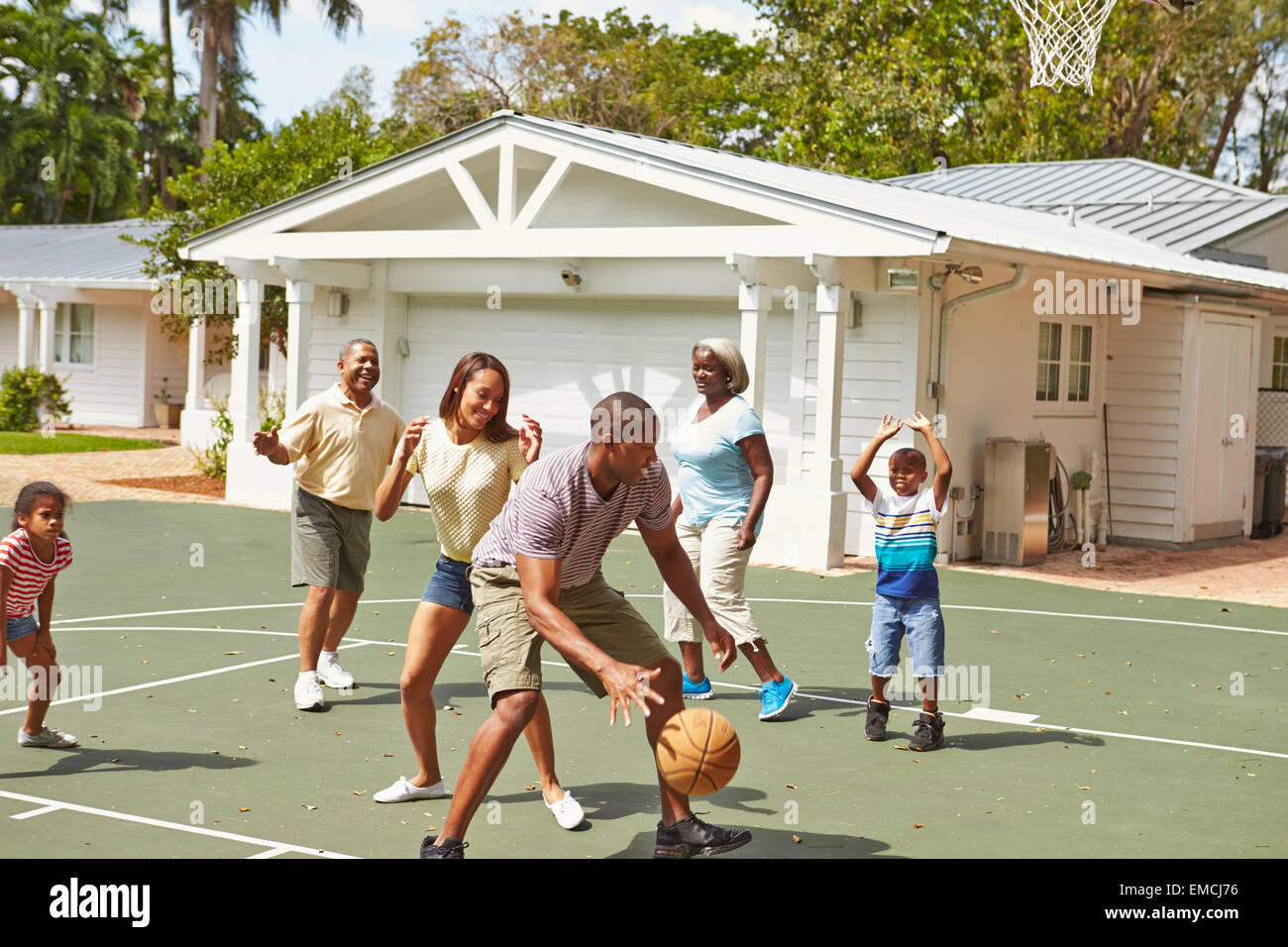 Multi Generation Family Playing Basketball Together Stock Photo - Alamy