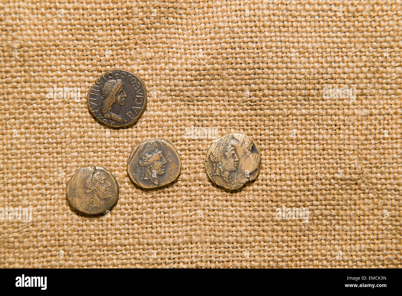 Ancient coins with portraits of emperors are on old sacking Stock Photo ...