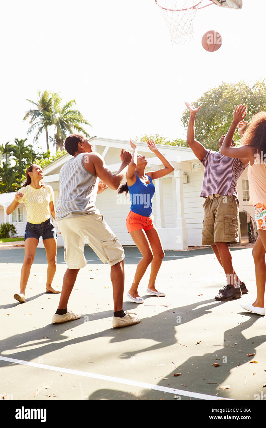 Group Of Young Friends Playing Basketball Match Stock Photo - Alamy