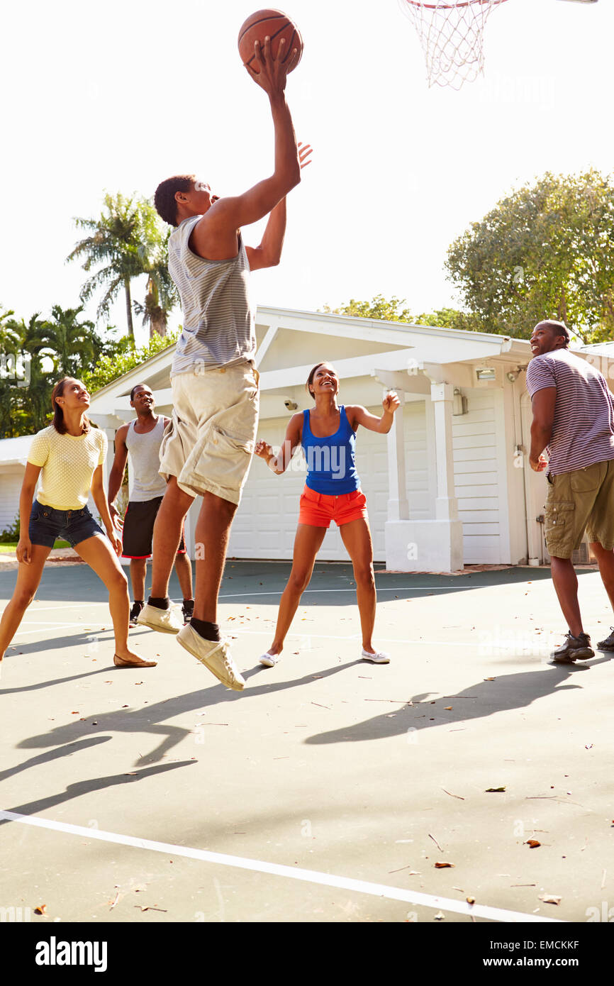 Group Of Young Friends Playing Basketball Match Stock Photo - Alamy