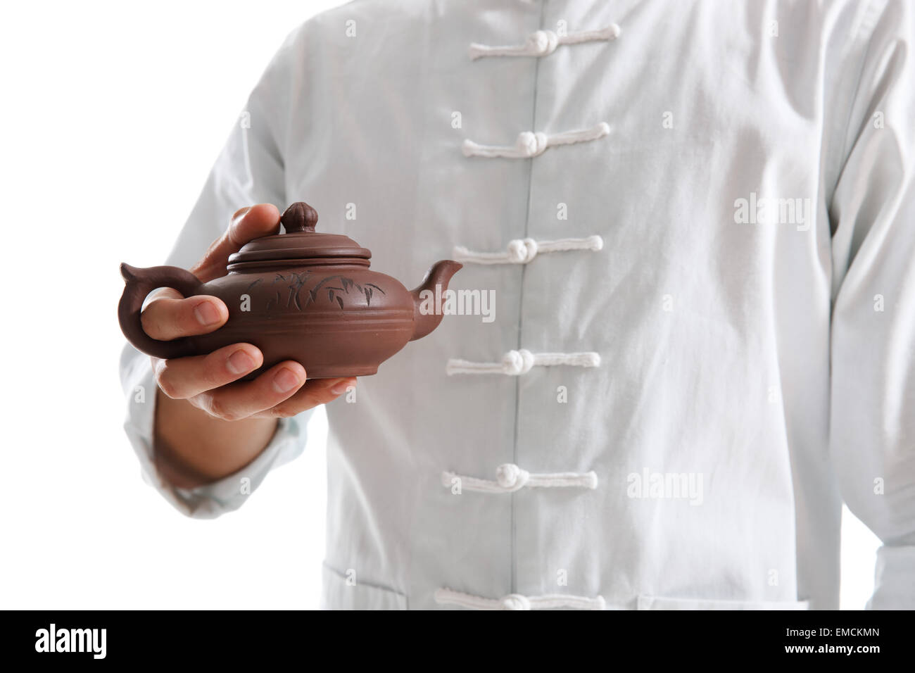 Dressed in traditional costumes of the young man took the teapot Stock ...