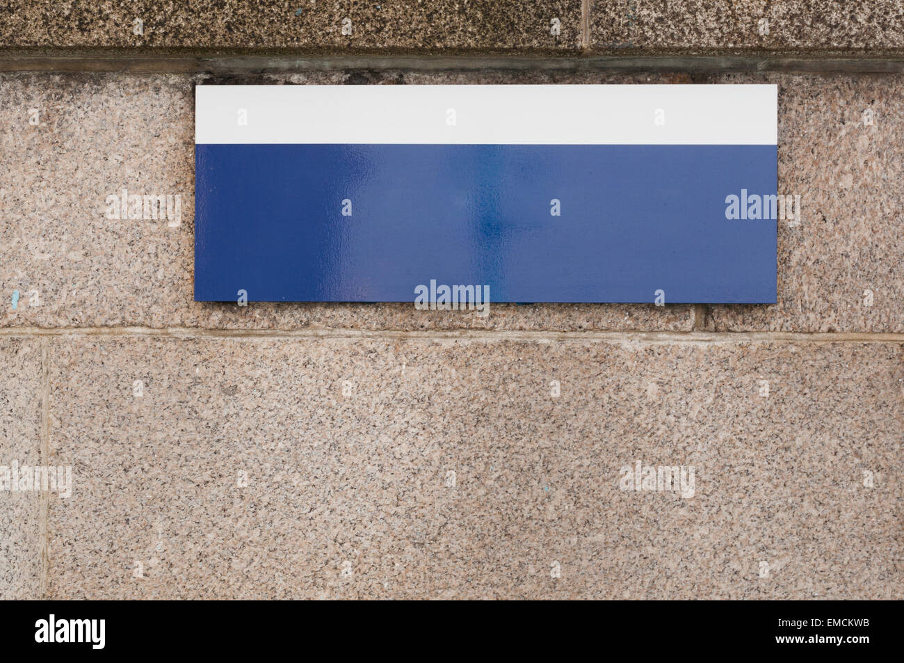 Empty sign mounted on a concrete wall Stock Photo - Alamy