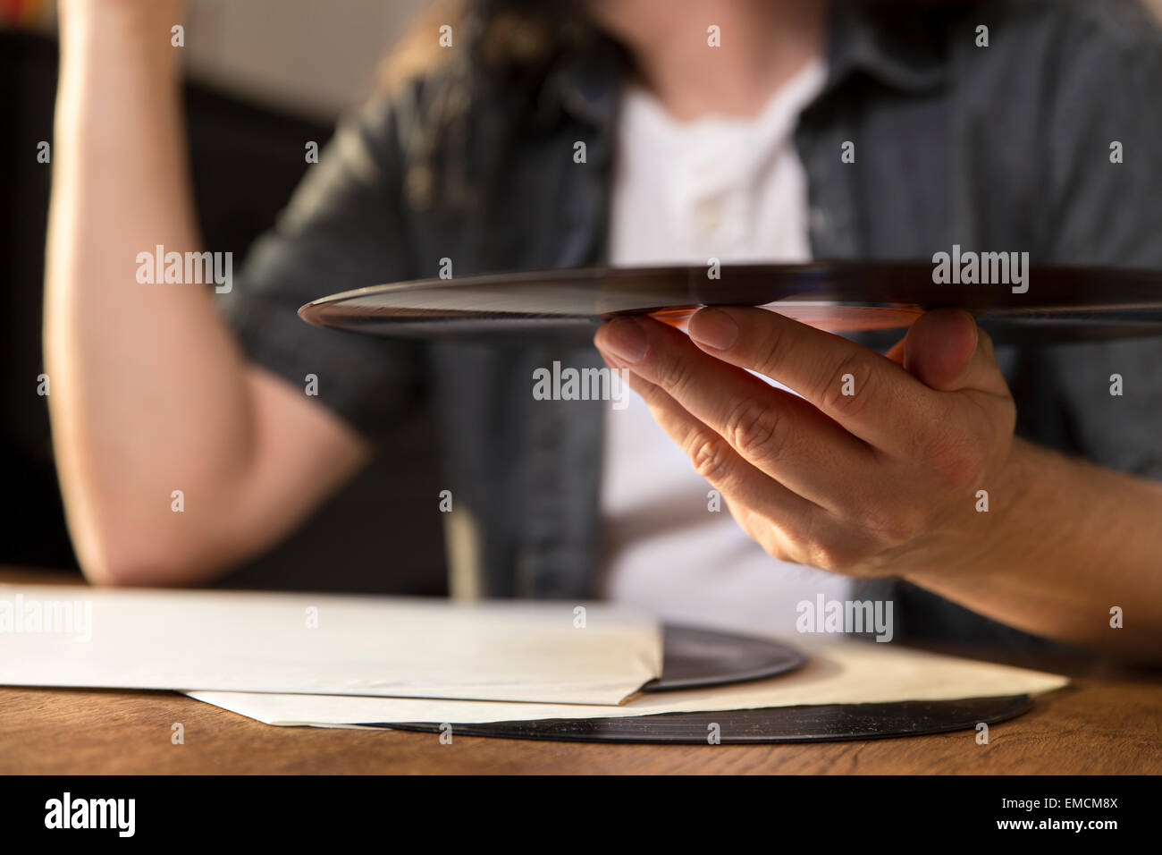 Man holding a record Stock Photo - Alamy