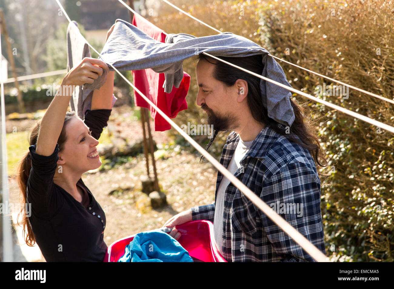 Woman hanging up laundry outdoor hi-res stock photography and images ...
